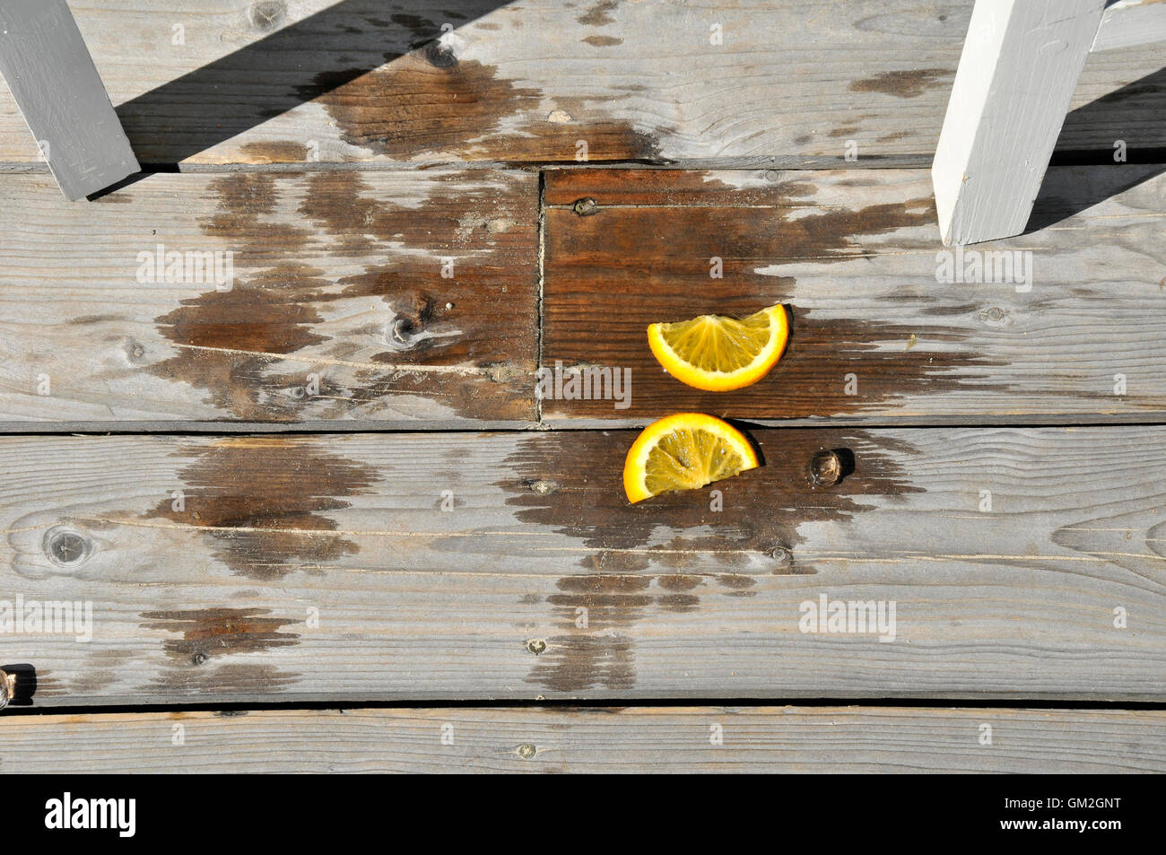 Spilled drink lemon wedges on floor Stock Photo - Alamy