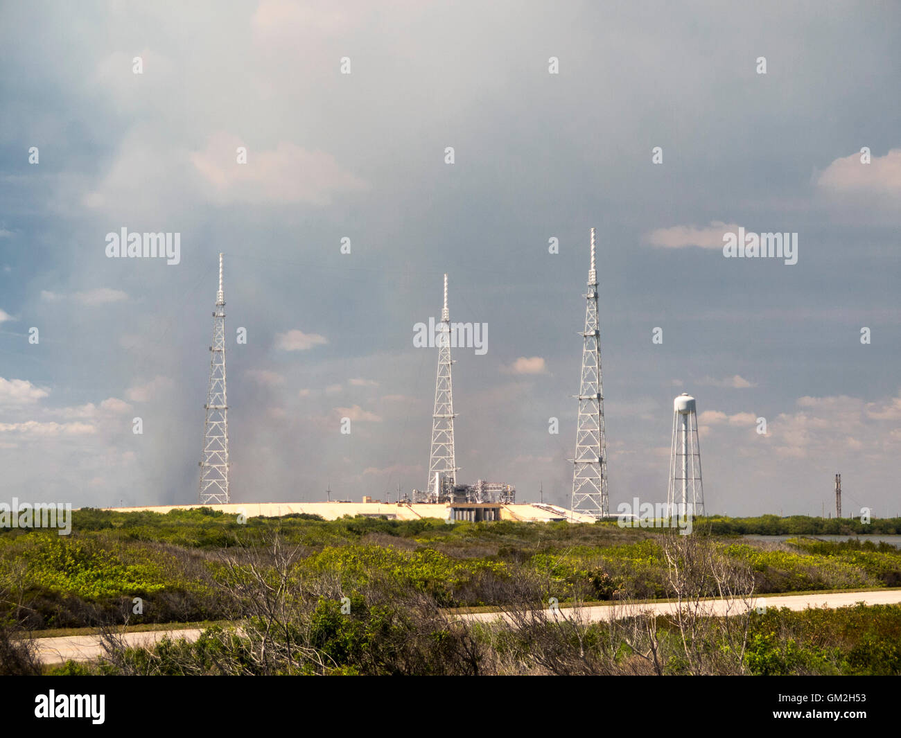 brush fire producing smoke behind Launch Pad 39B towers originally ...