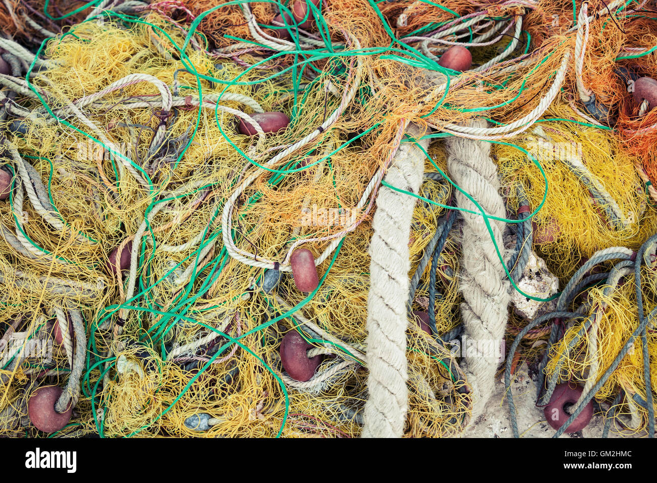 Colorful fishing net drying on pier in Greece, background photo Stock ...