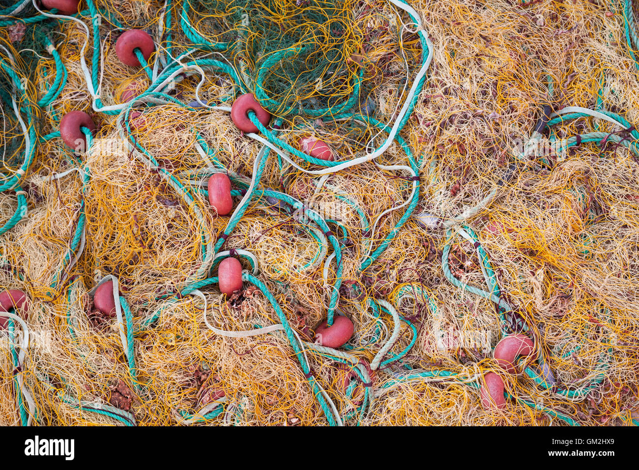 Colorful fishing net drying on a pier, background photo Stock Photo - Alamy