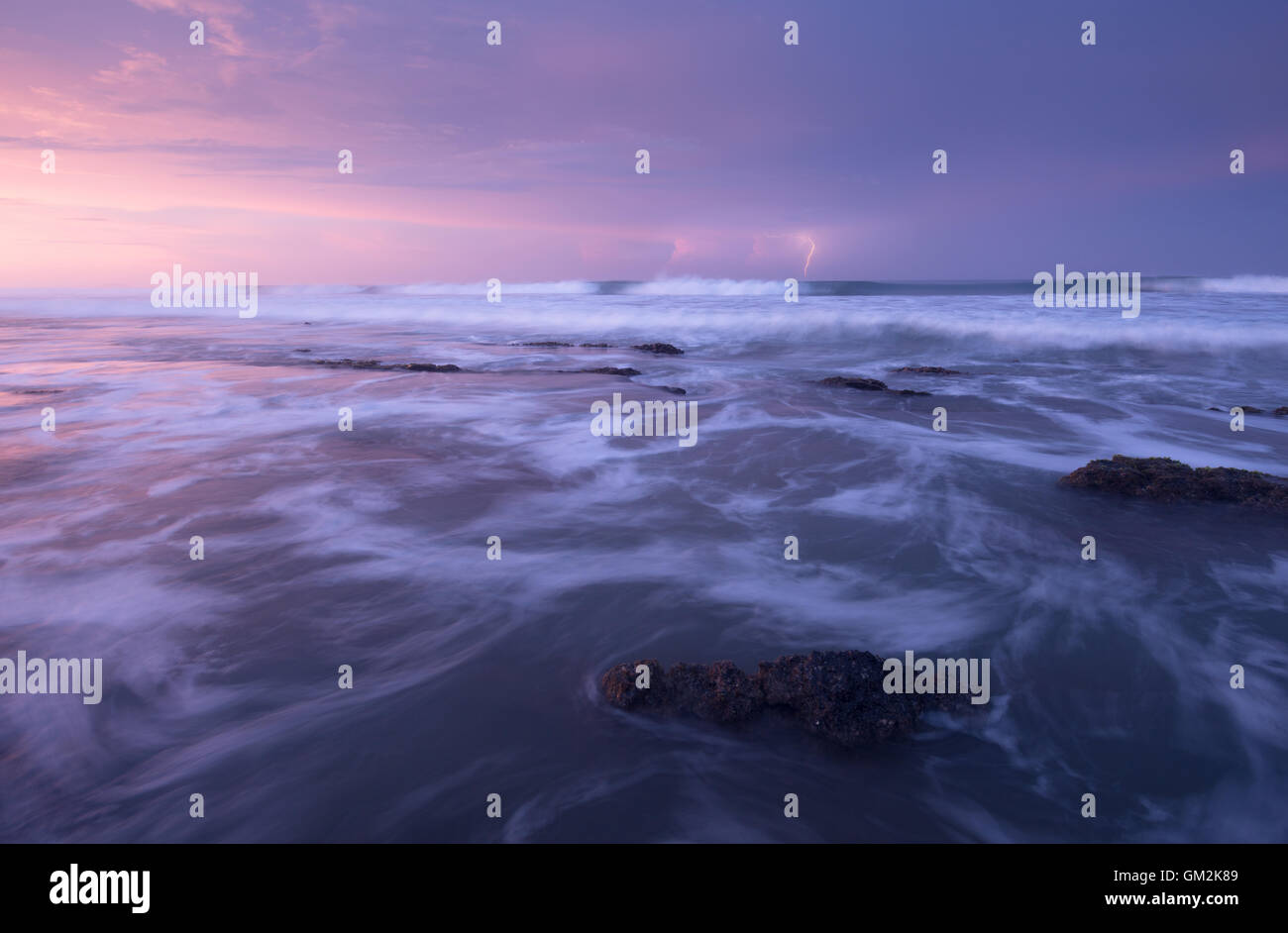 Dreamy peaceful sunset with lightning Stock Photo - Alamy