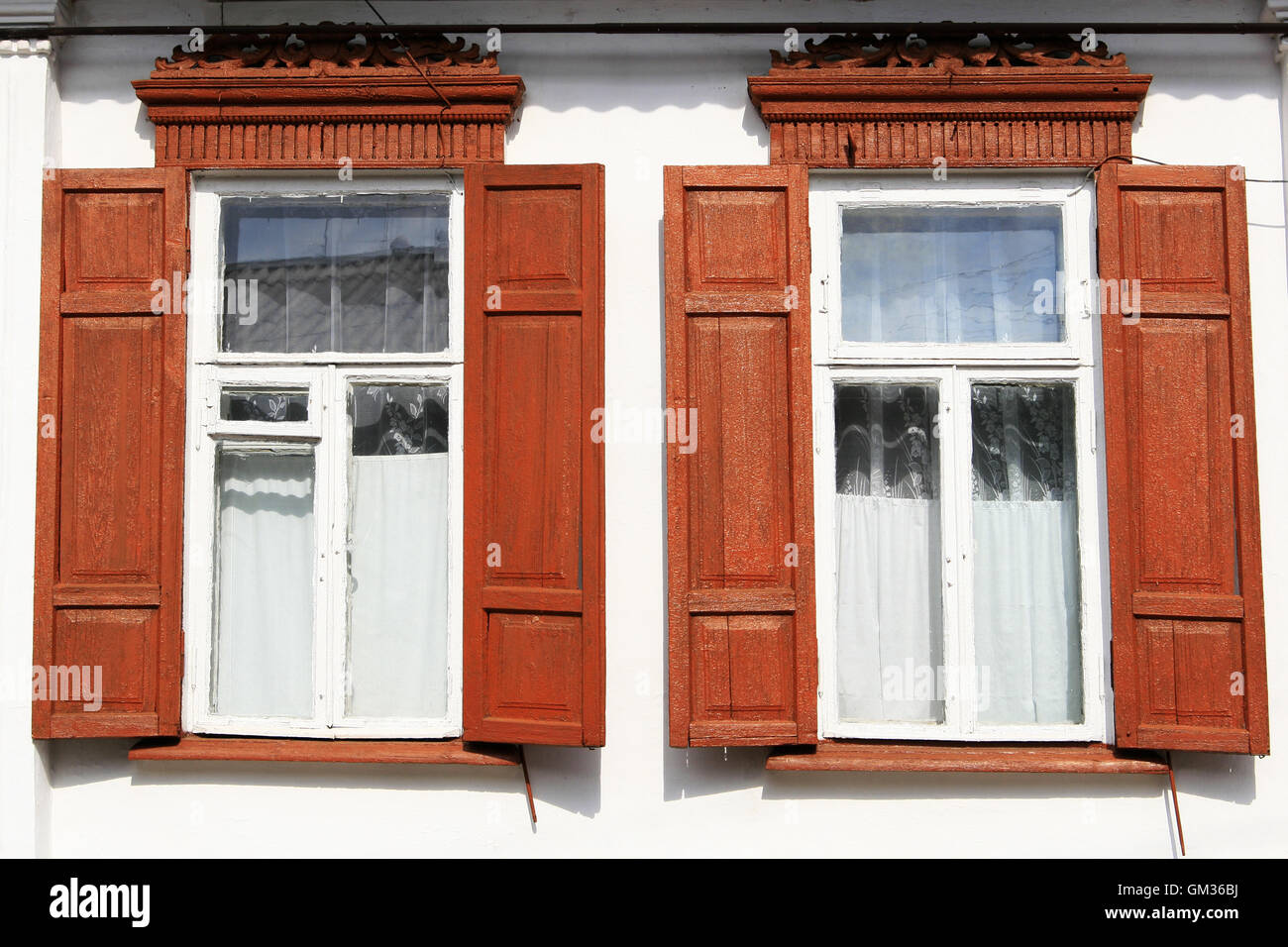 Two old windows with wooden red shutters Stock Photo - Alamy