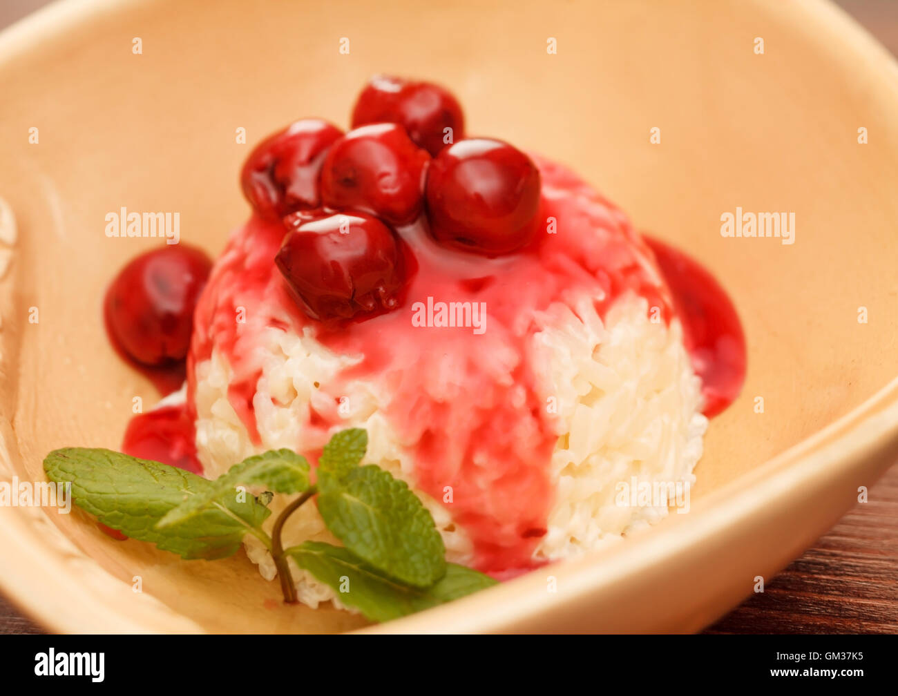 Rice pudding with cherry Stock Photo - Alamy