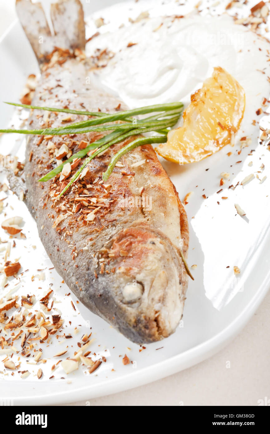 trout fish baked with nuts Stock Photo - Alamy
