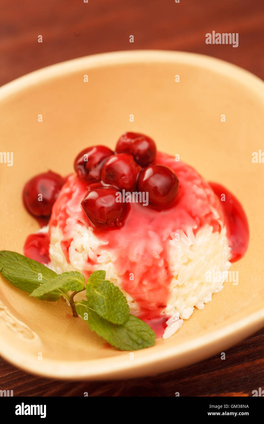 Rice pudding with cherry Stock Photo - Alamy