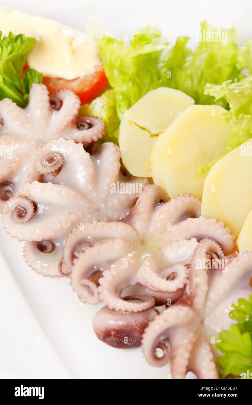 octopus with potatoes Stock Photo - Alamy