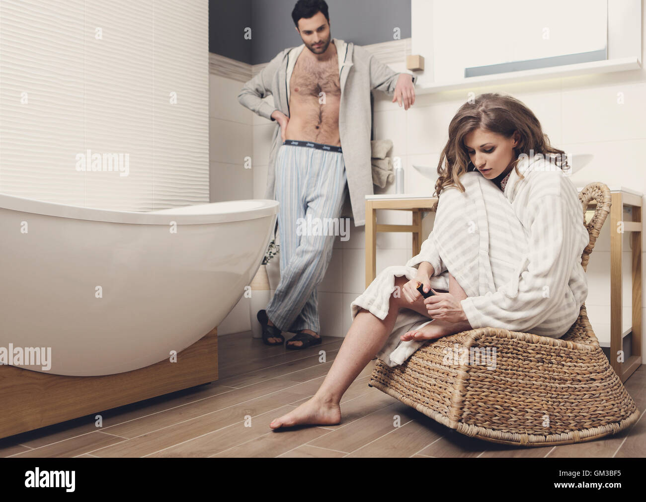 Young beautiful couple in the bathroom Stock Photo - Alamy