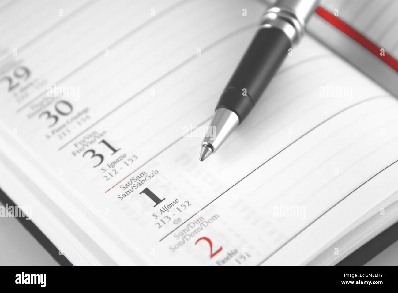 Pen on open diary Stock Photo - Alamy