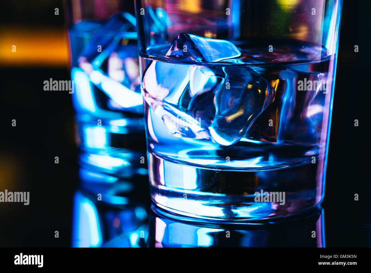 Two glasses of vodka with ice closeup Stock Photo - Alamy