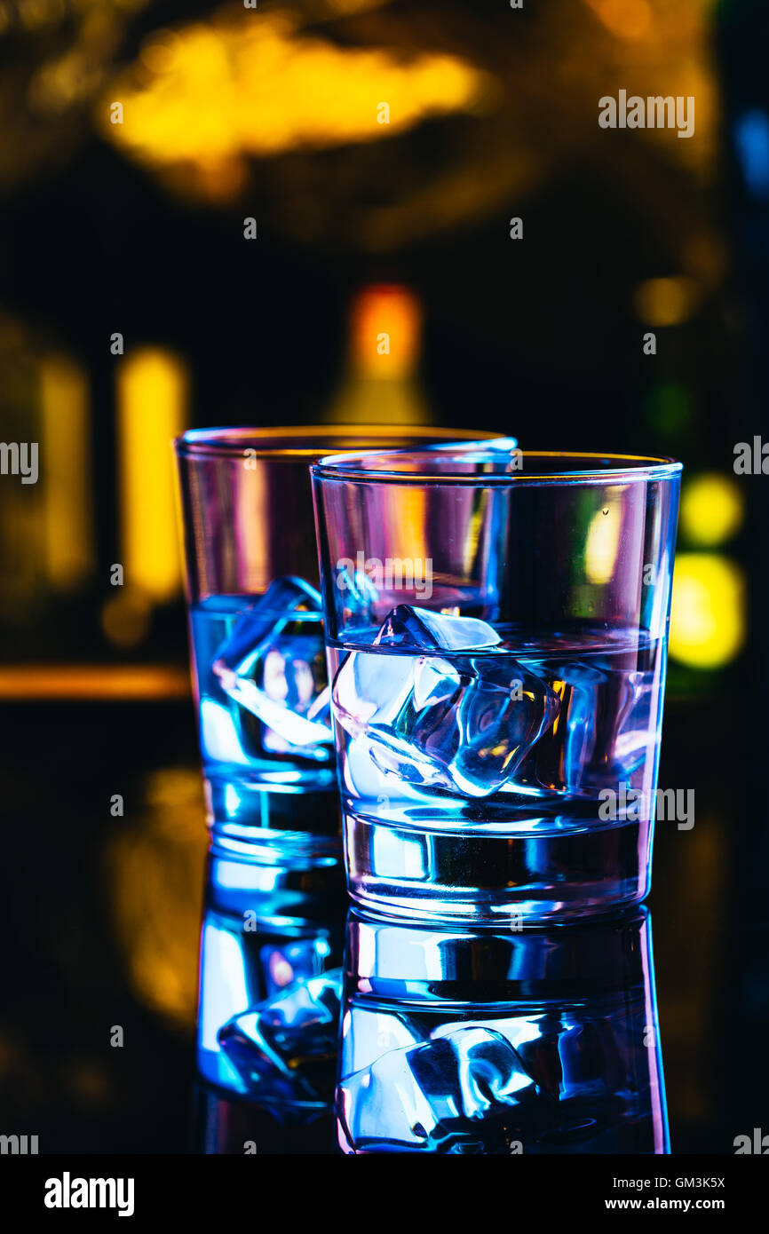 Two glasses of vodka with ice closeup Stock Photo - Alamy