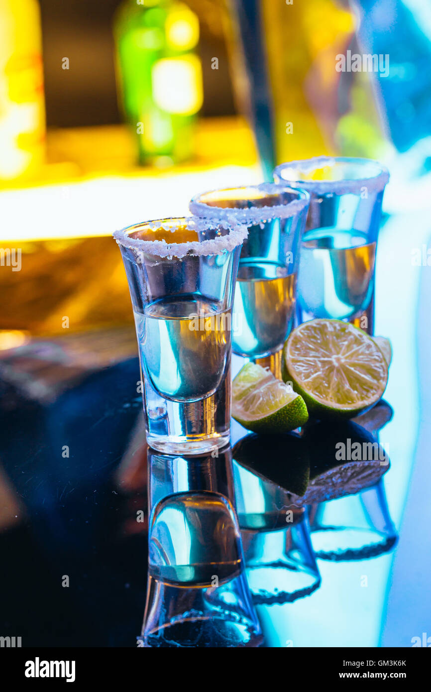 stack of tequila with salt close up on blurred background Stock Photo ...