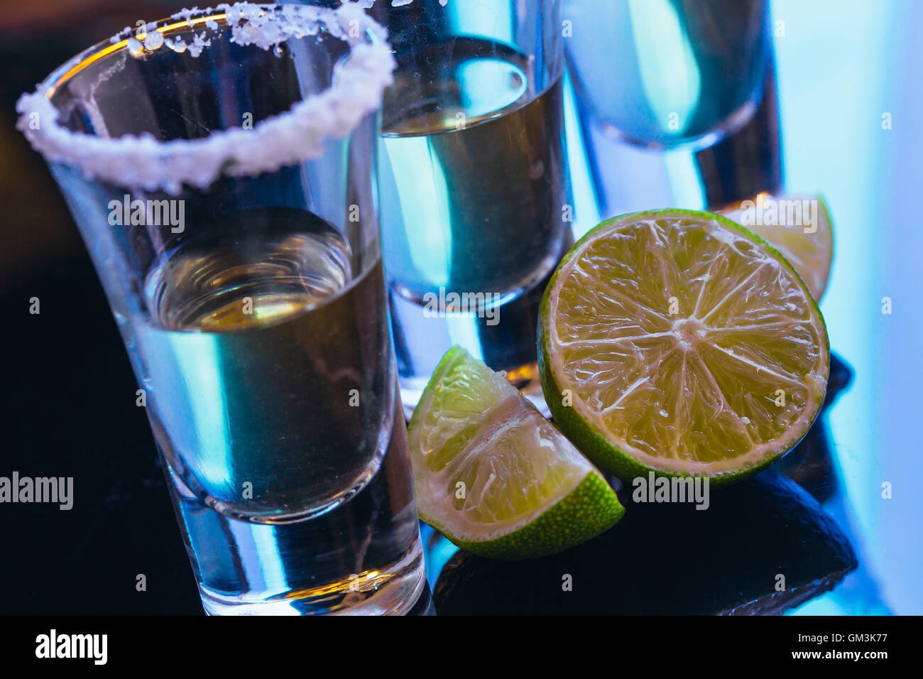 stack of tequila with salt close up on blurred background Stock Photo ...