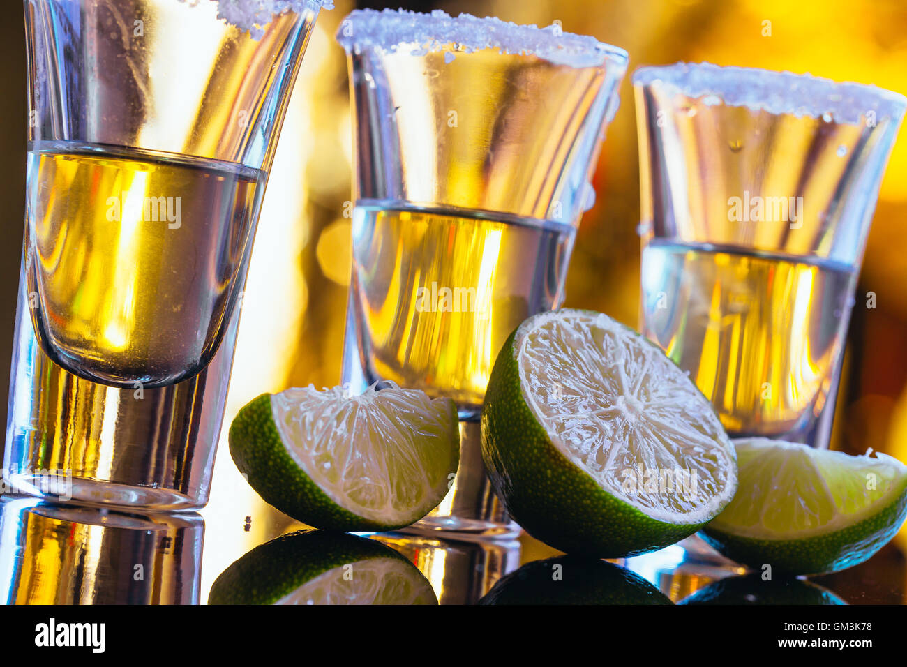 stack of tequila with salt close up on blurred background Stock Photo ...