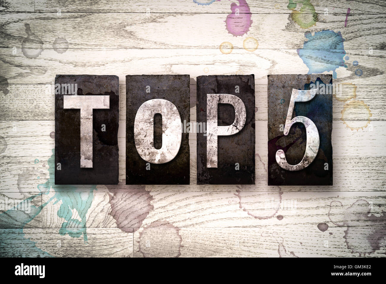 The word "TOP 5" written in vintage dirty metal letterpress type on a ...