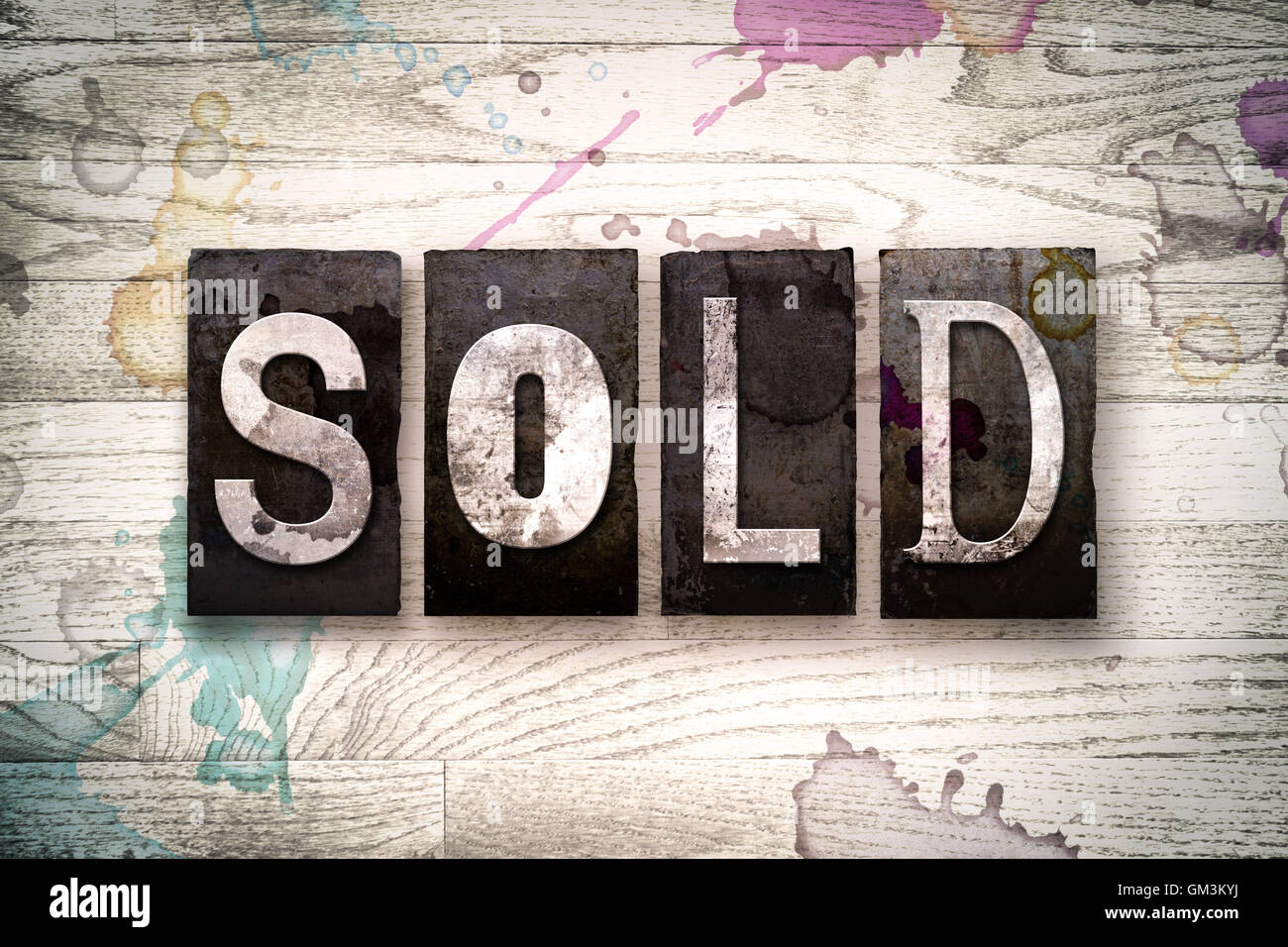 The word "SOLD" written in vintage dirty metal letterpress type on a ...