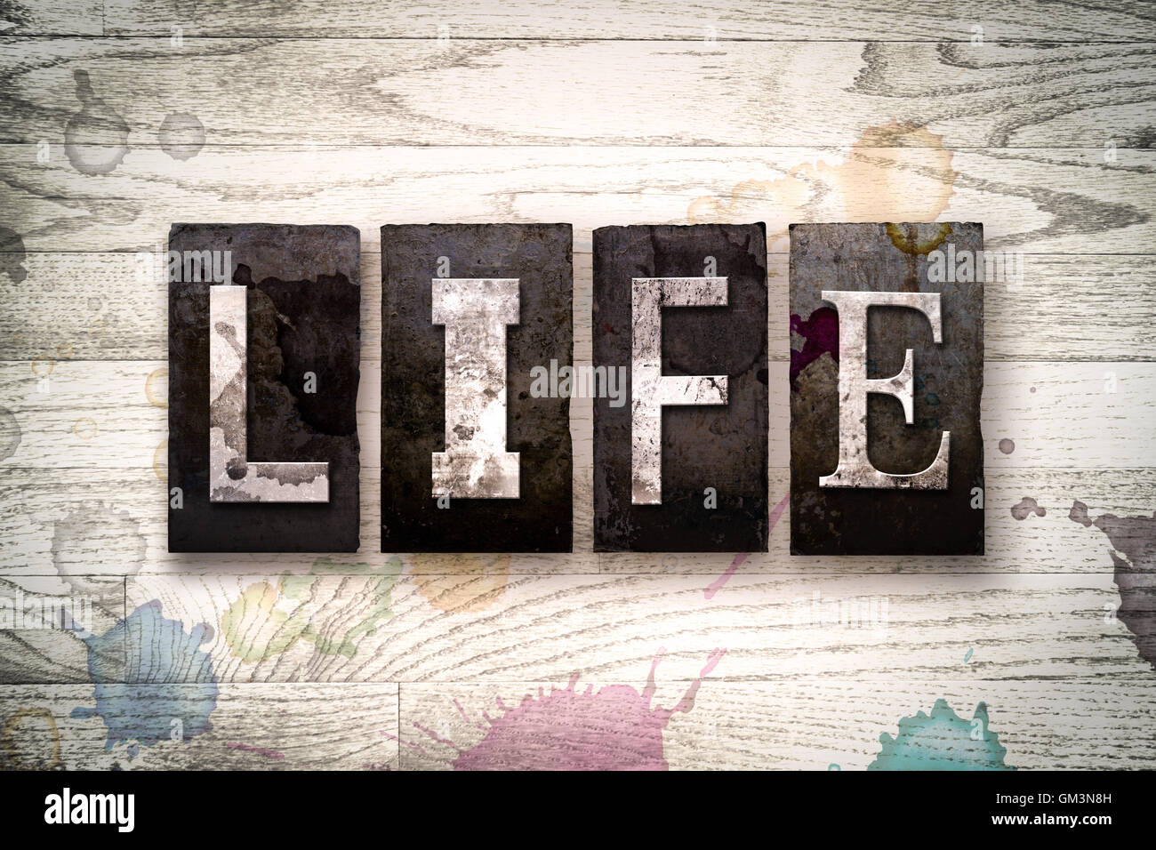 The word "LIFE" written in vintage dirty metal letterpress type on a ...