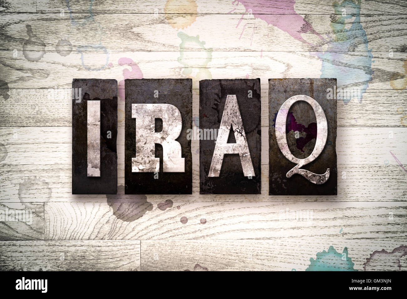 The word "IRAQ" written in vintage dirty metal letterpress type on a ...