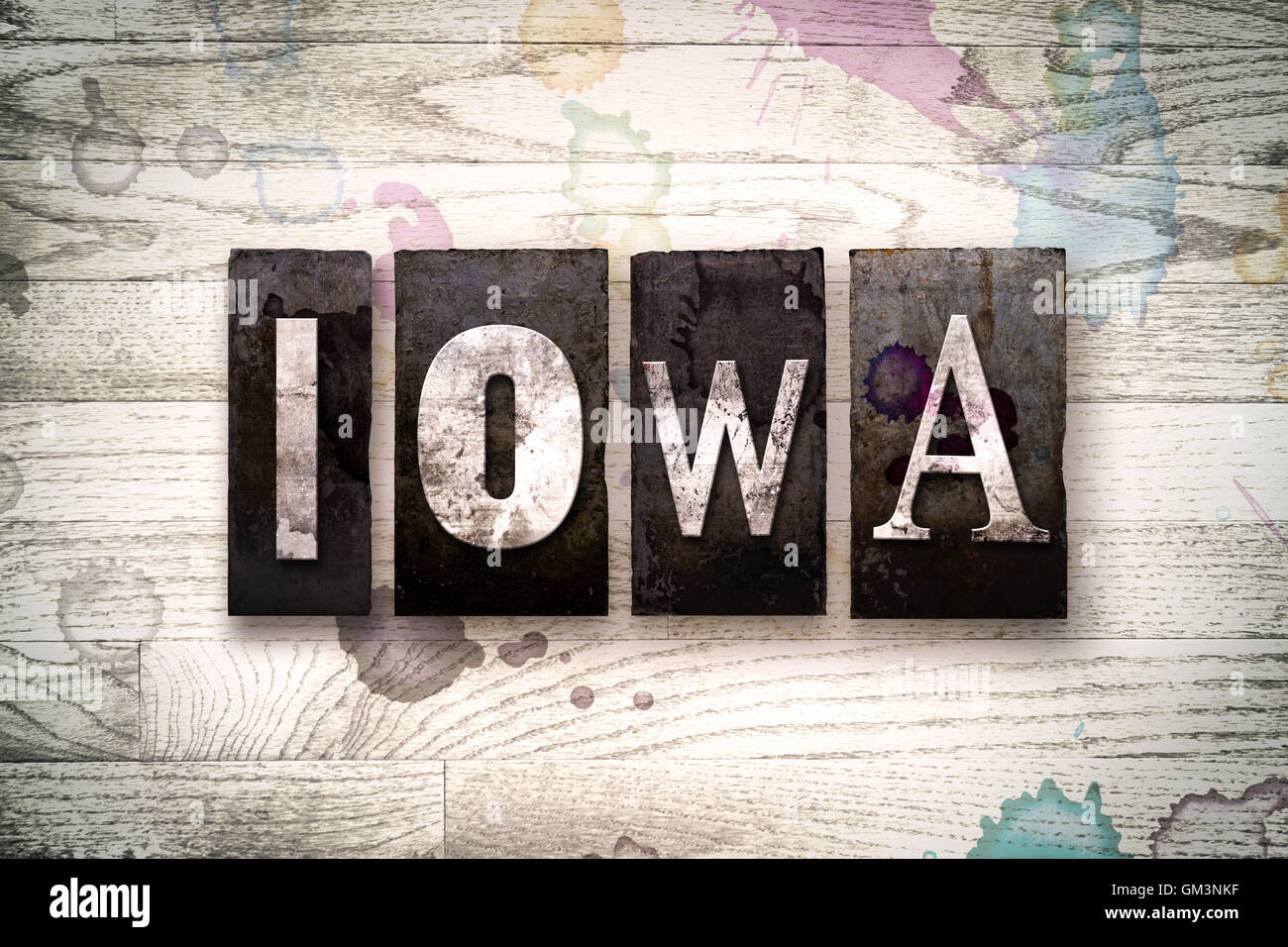 The word "IOWA" written in vintage dirty metal letterpress type on a ...