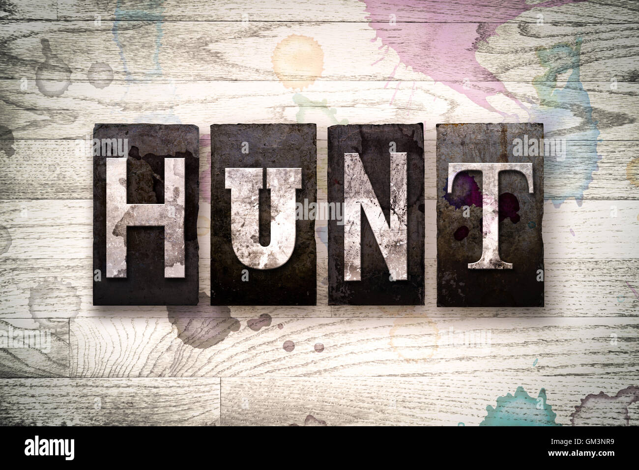 The word "HUNT" written in vintage dirty metal letterpress type on a ...