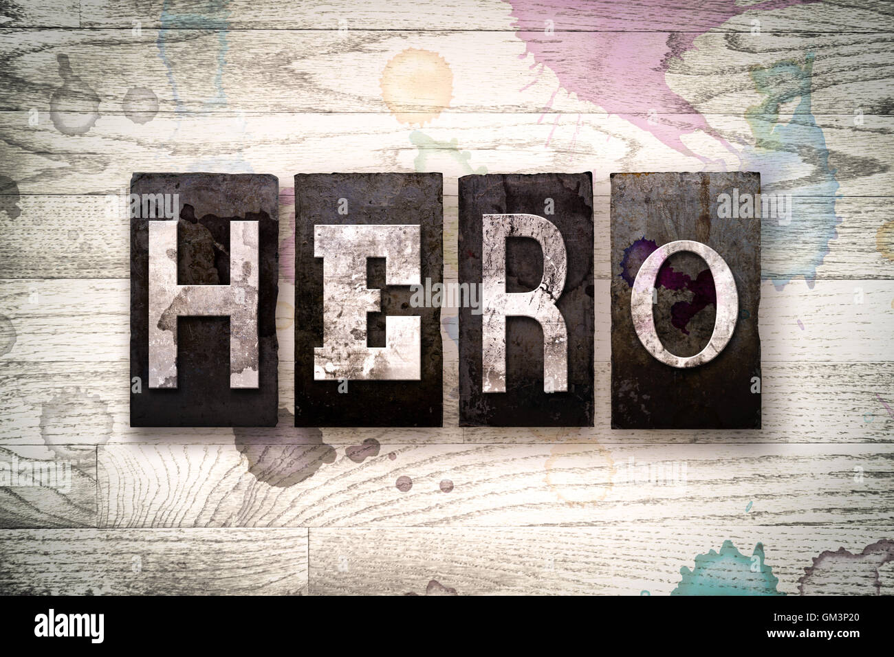 The word "HERO" written in vintage dirty metal letterpress type on a ...