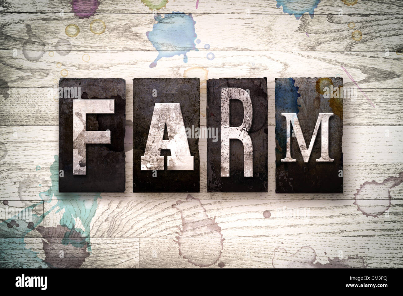 The word "FARM" written in vintage dirty metal letterpress type on a ...