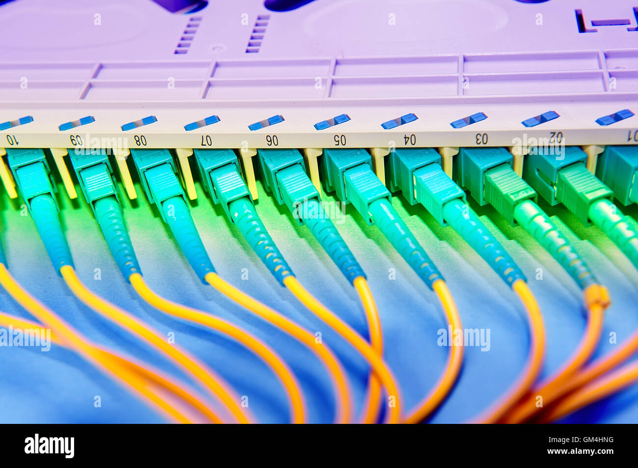 Fiber network switch with some yellow optical network cables Stock ...