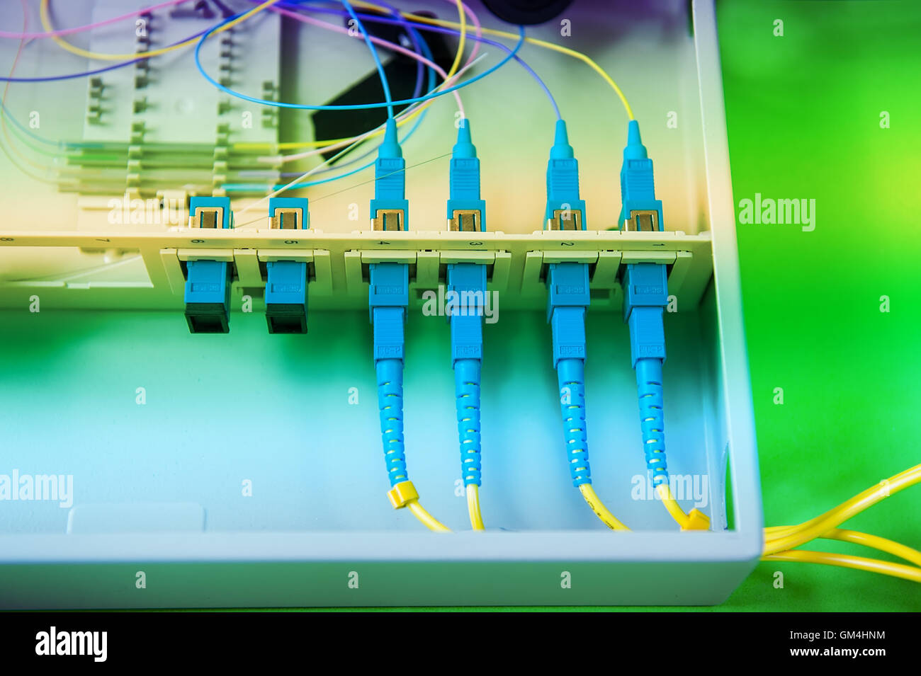Fiber network switch with some yellow optical network cables Stock ...