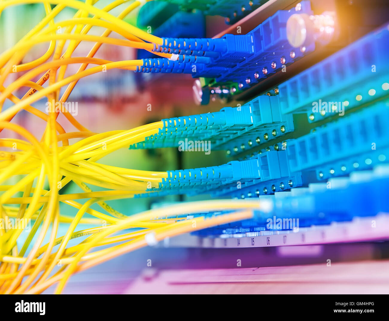Fiber network switch with some yellow optical network cables Stock ...