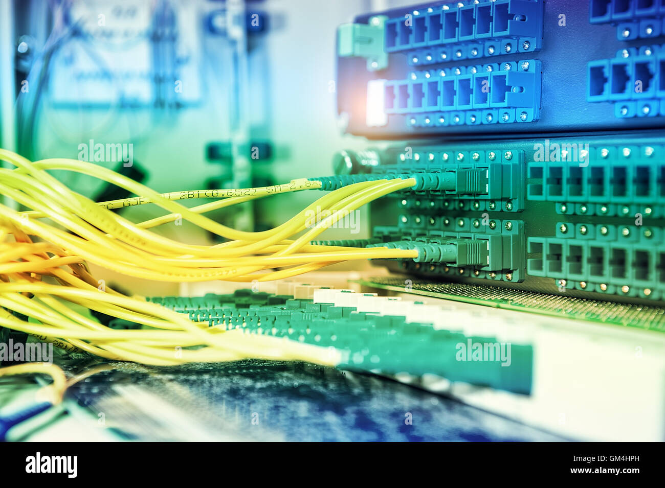 Fiber network switch with some yellow optical network cables Stock ...