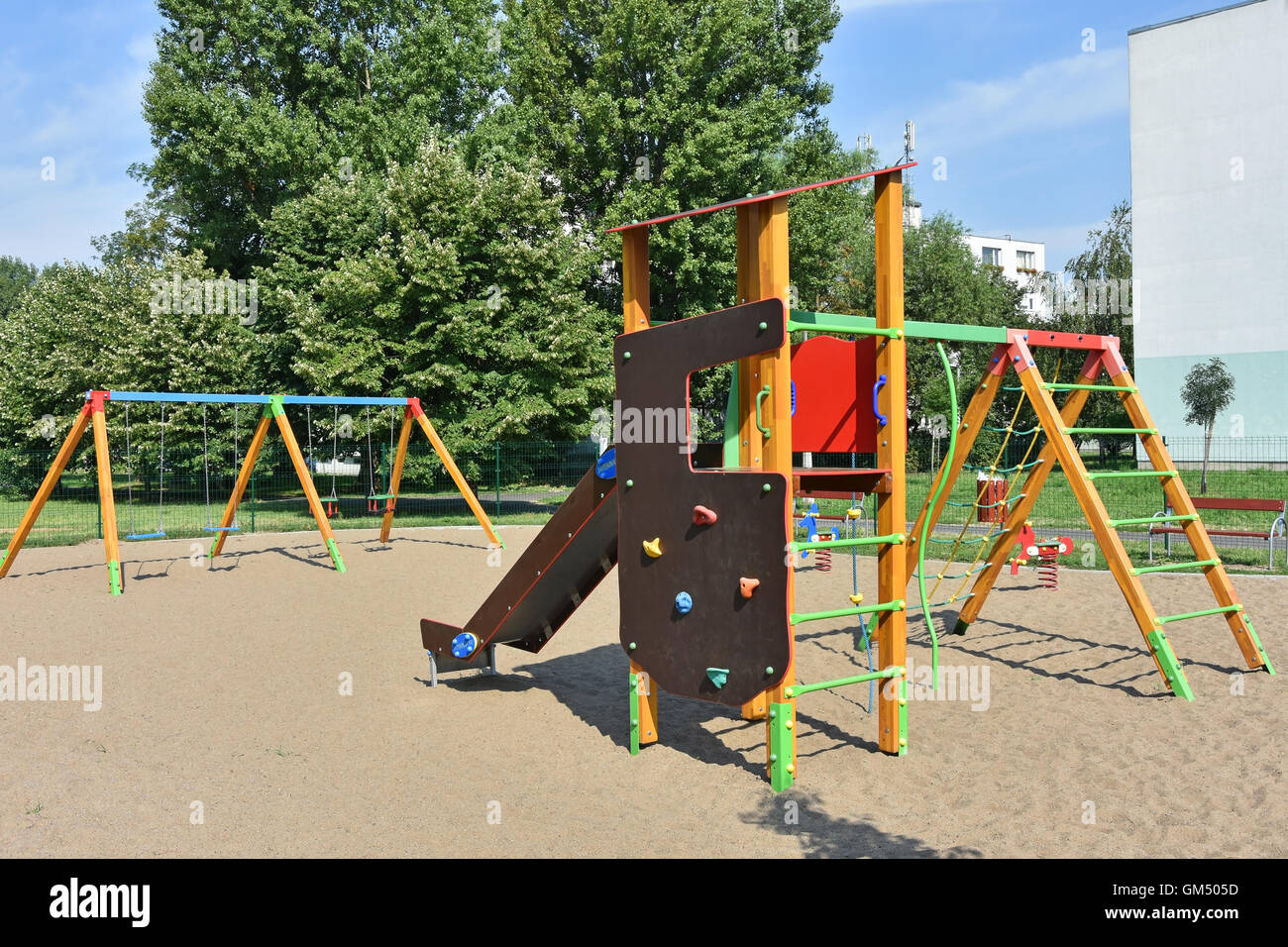Jungle gym and swing at the playground in the city Stock Photo - Alamy
