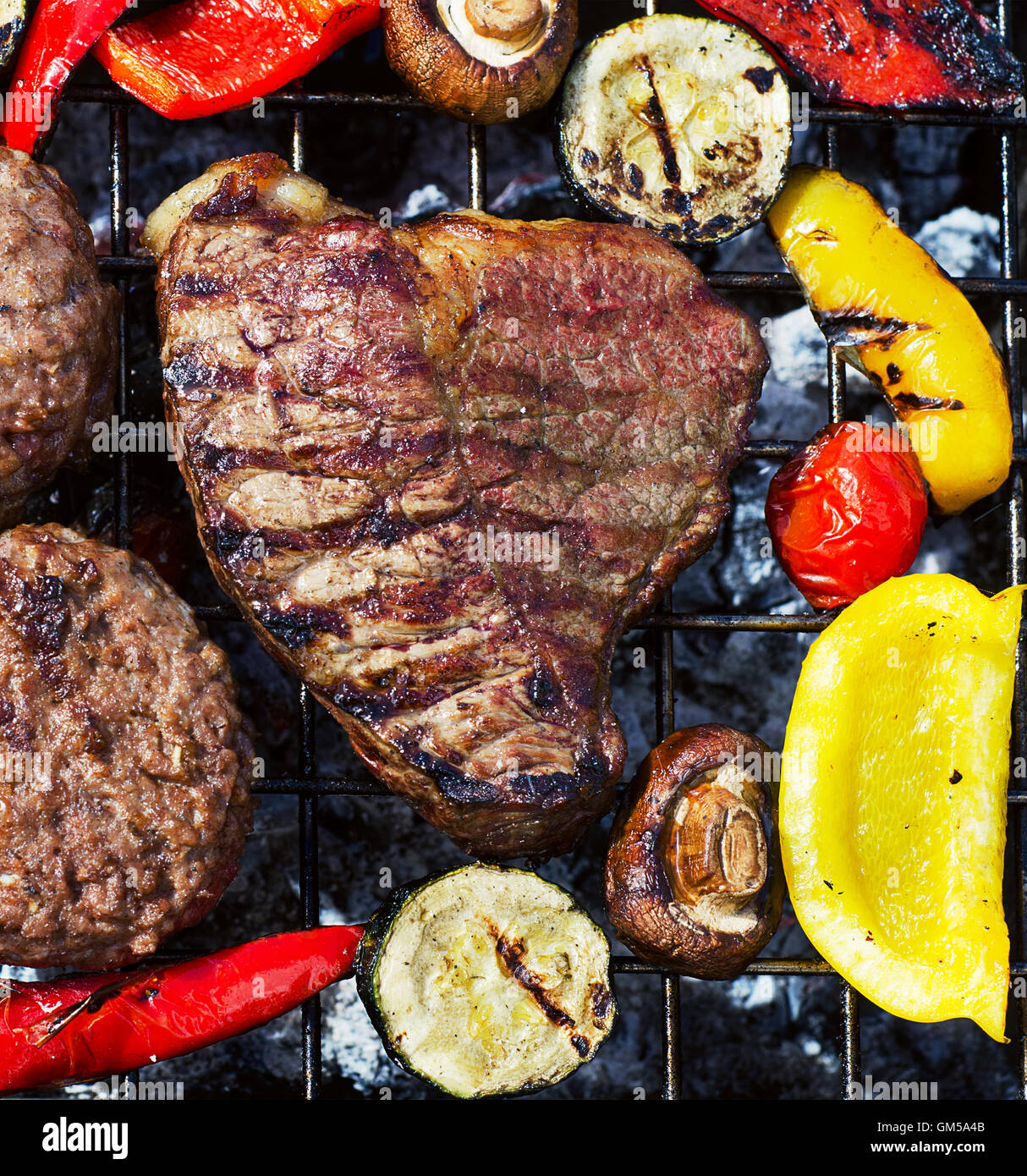 Grilled steak with vegetables. Top view Stock Photo - Alamy