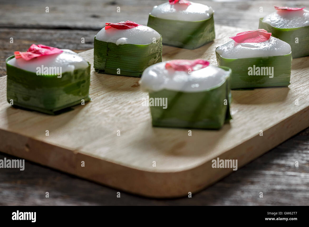pudding with coconut topping on Wooden floor Stock Photo - Alamy