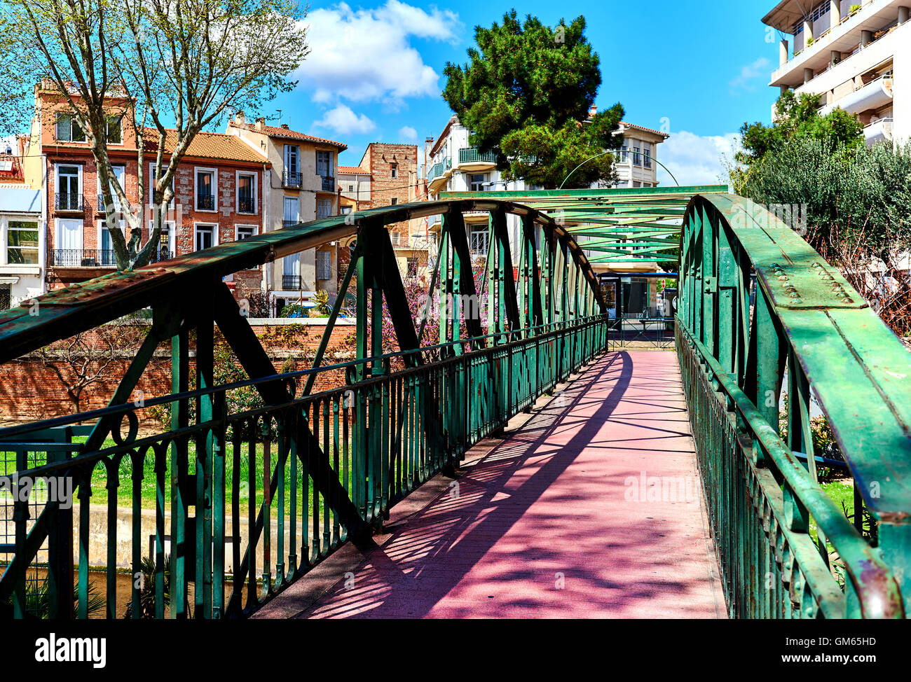 Spring in the Perpignan city. Footbridge across the city canal in the ...