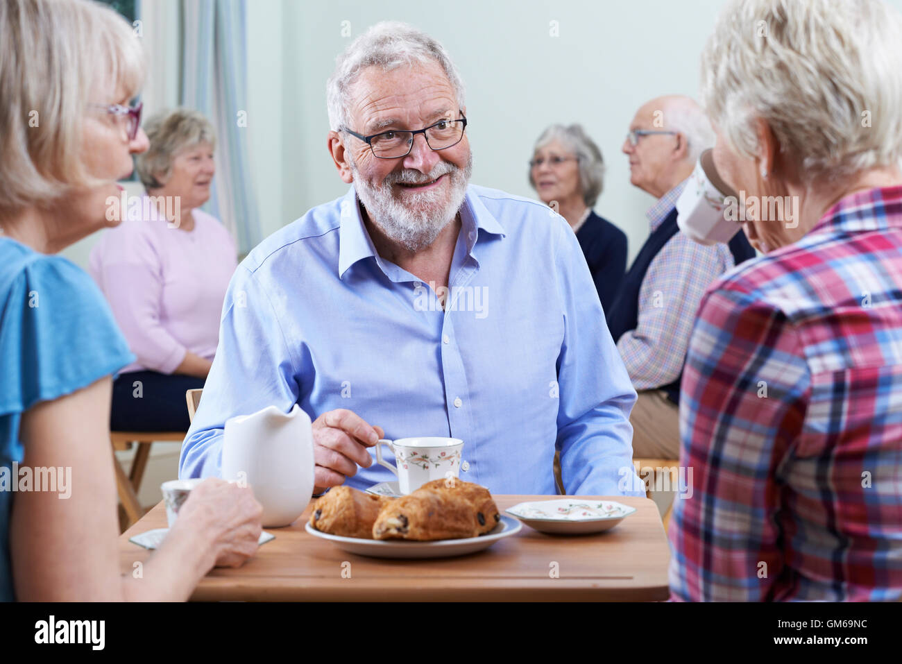 Group Of Seniors Meeting At Social Club Stock Photo - Alamy