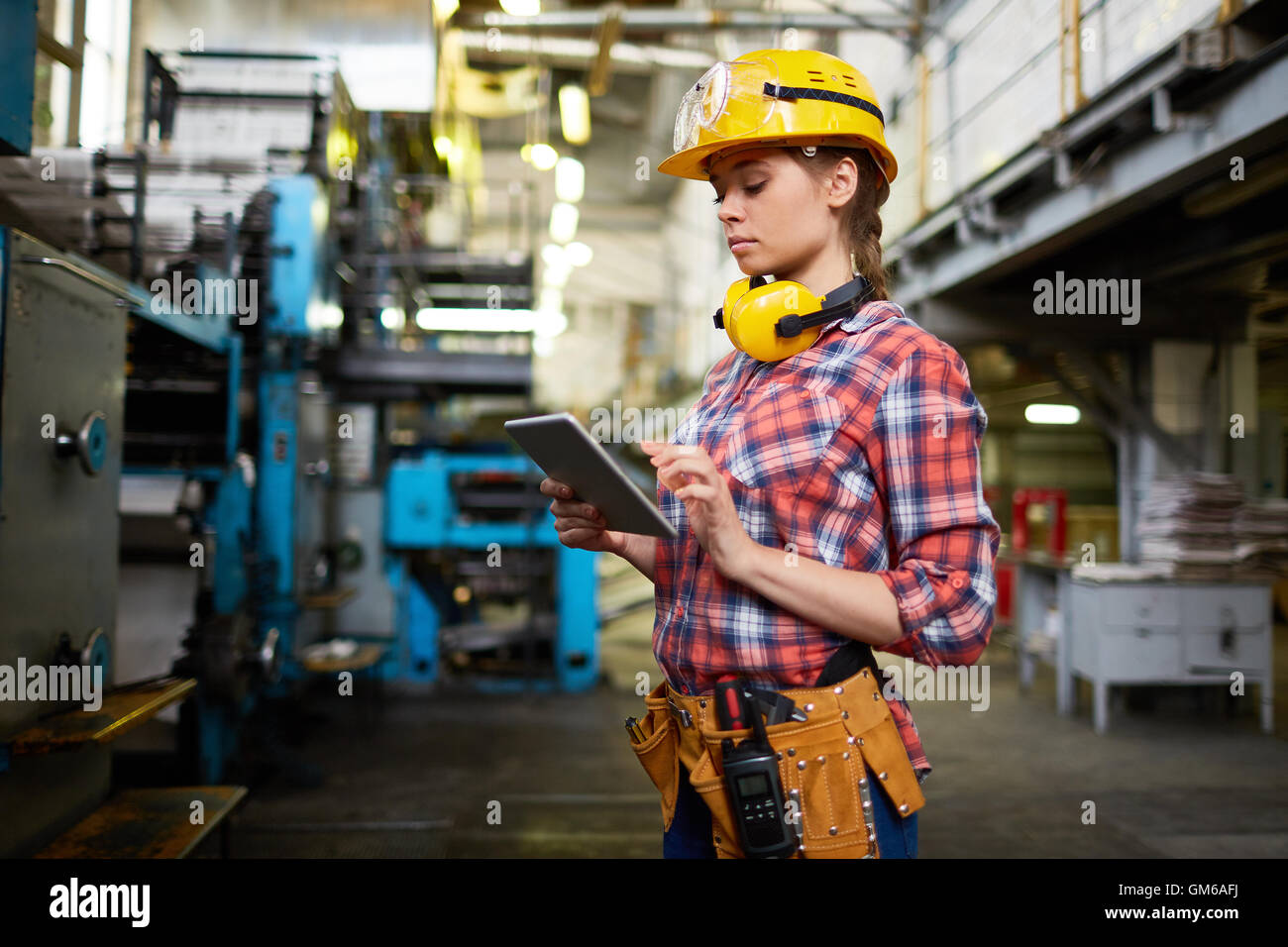 Female engineer using digital tablet for work Stock Photo - Alamy