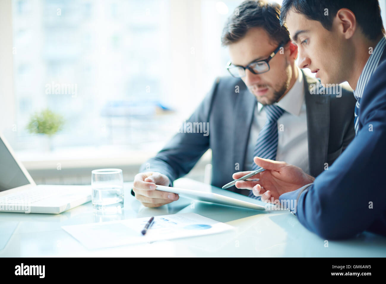 Businessmen with computer Stock Photo - Alamy