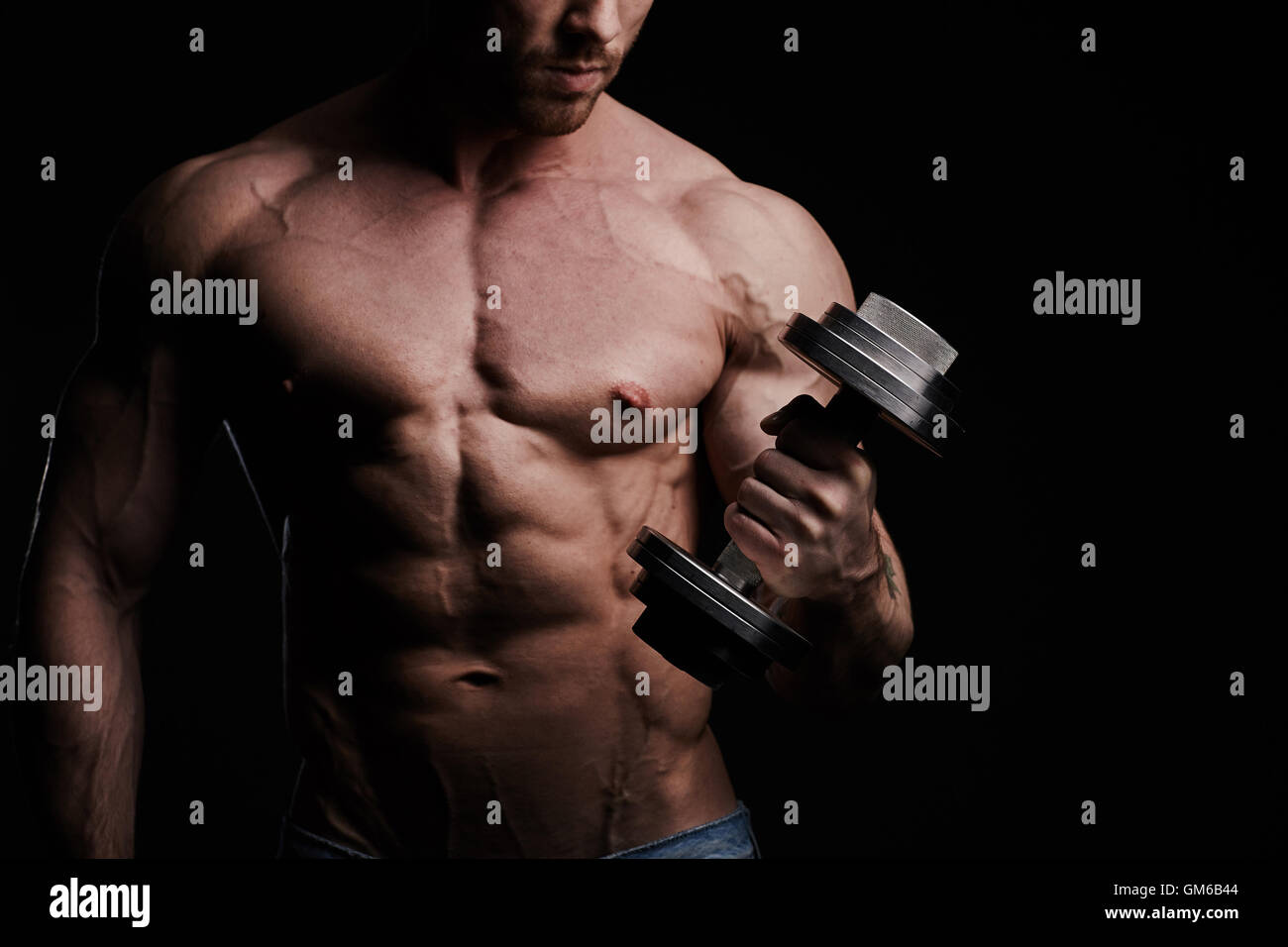 Sport man bodybuilder exercising hi-res stock photography and images ...