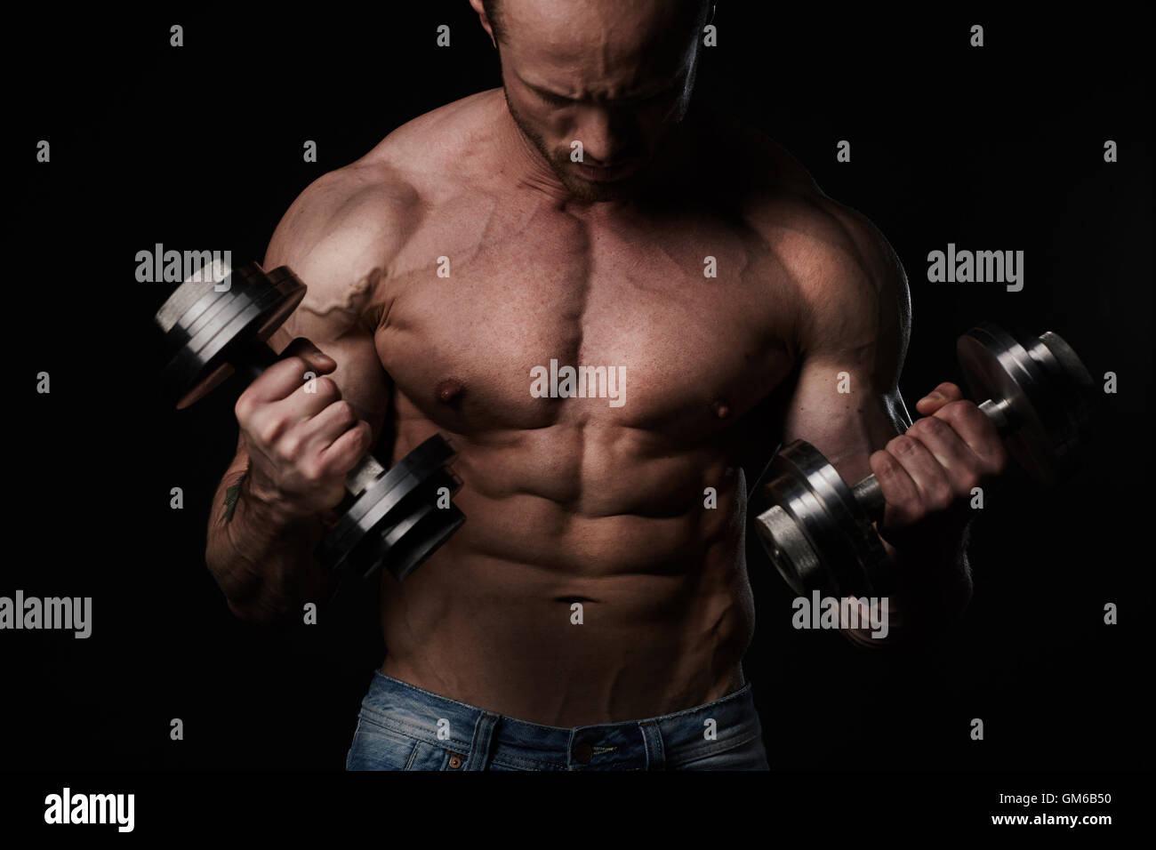 Handsome fit man holding hi-res stock photography and images - Alamy