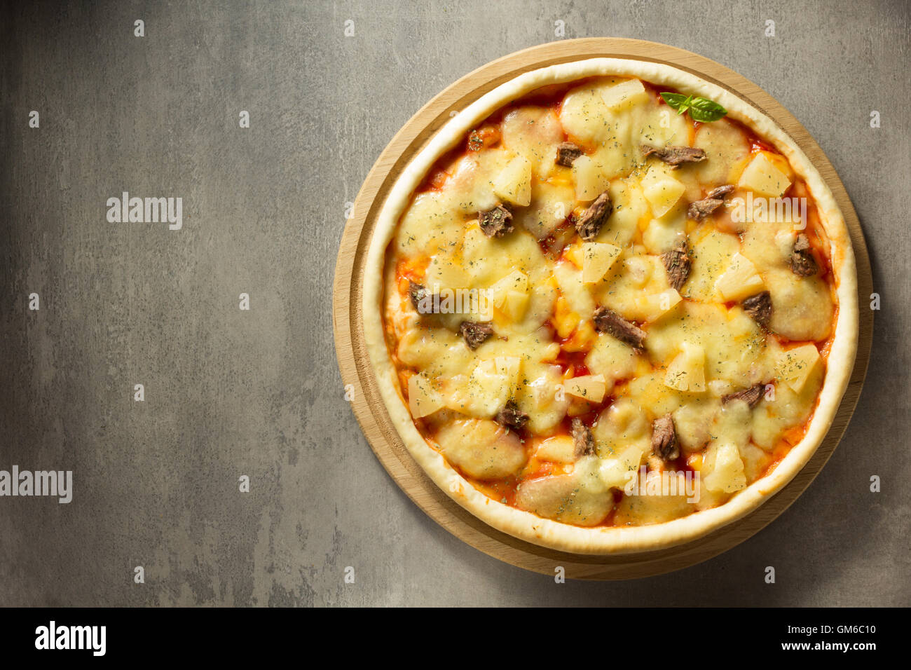 italian pizza at table background Stock Photo - Alamy