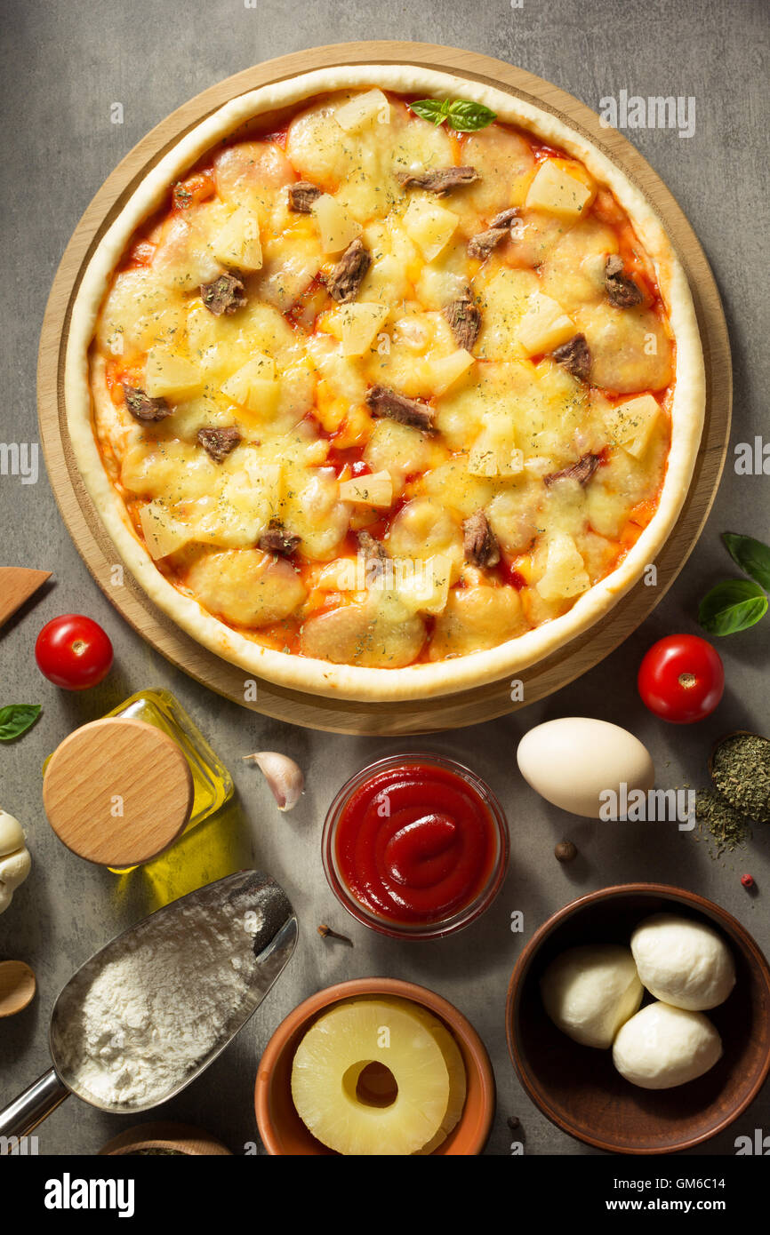 italian pizza at table background Stock Photo - Alamy