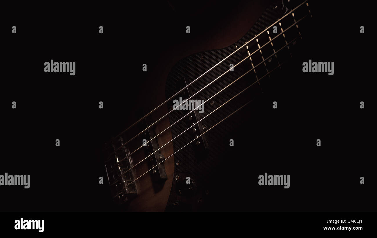 Details of an electric bass guitar with five strings Stock Photo - Alamy