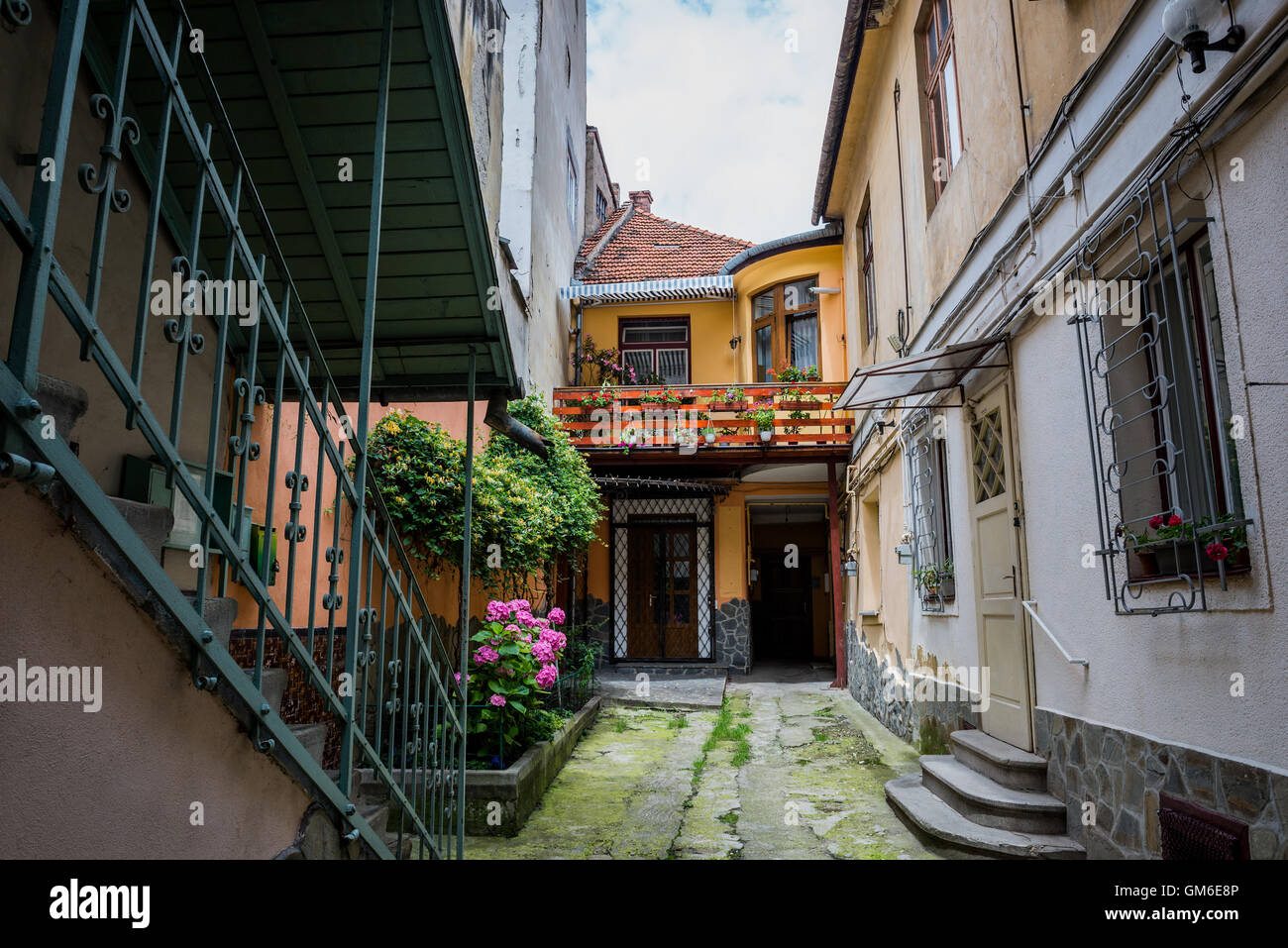 Courtyard of small tenement houses in Brasov city in Romania Stock ...