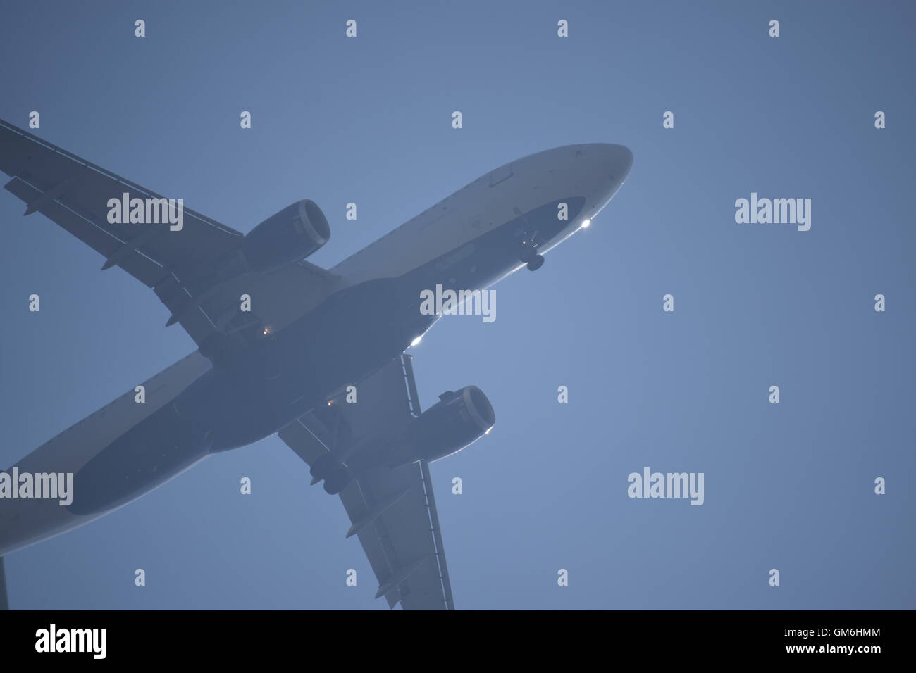 Overhead Jet flying in smoke Stock Photo - Alamy