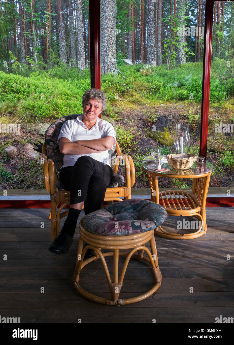 Woman sitting on terrace Stock Photo - Alamy