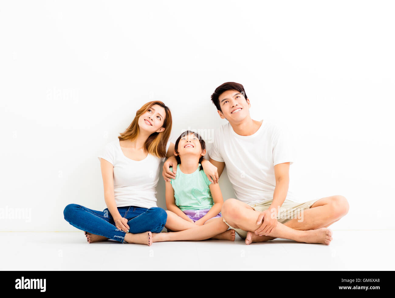 Happy Attractive Young Family looking up Stock Photo - Alamy Happy Attractive Young Family looking up Stock Photo - Alamy