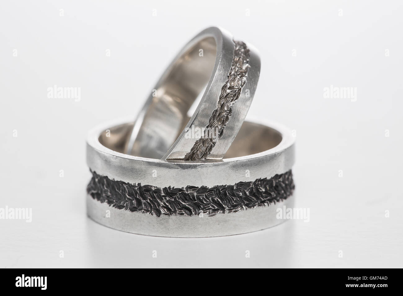 Two wedding rings on a white background. Mr. and Mrs Stock Photo - Alamy