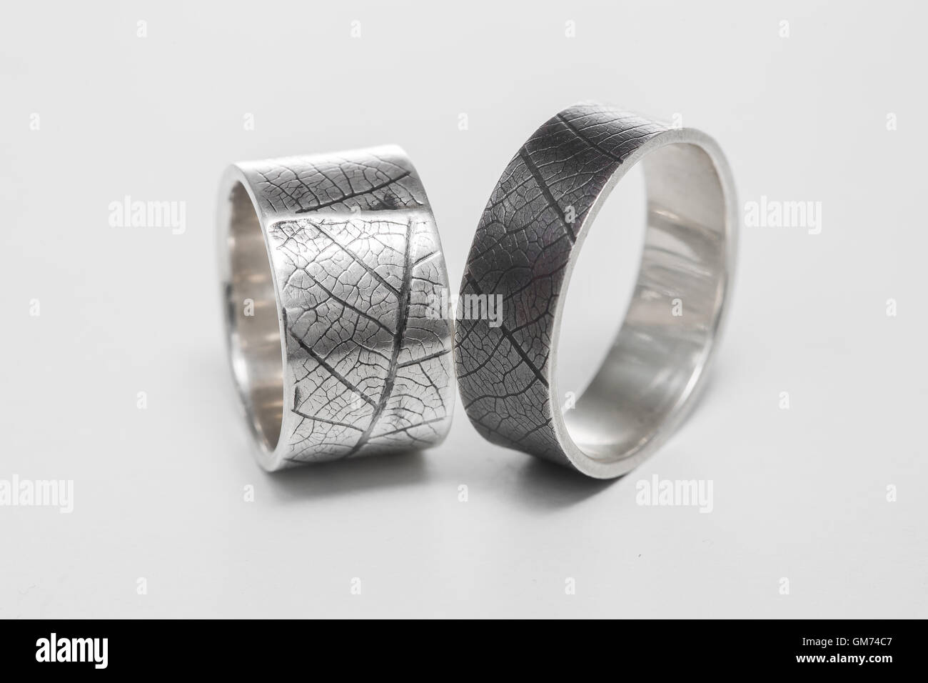 Two wedding rings on a white background. Mr. and Mrs Stock Photo - Alamy