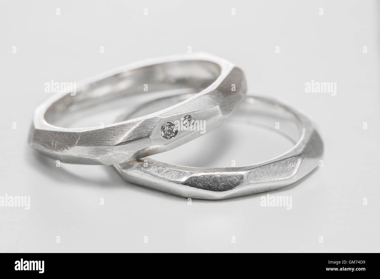 Two wedding rings on a white background. Mr. and Mrs Stock Photo - Alamy