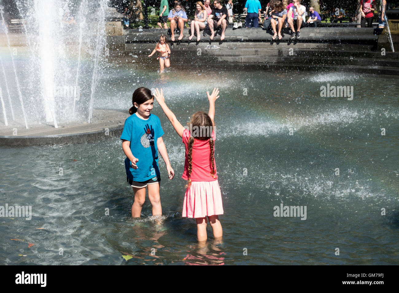 Girl Playing In Water Fountain Stock Photos & Girl Playing In Water ...