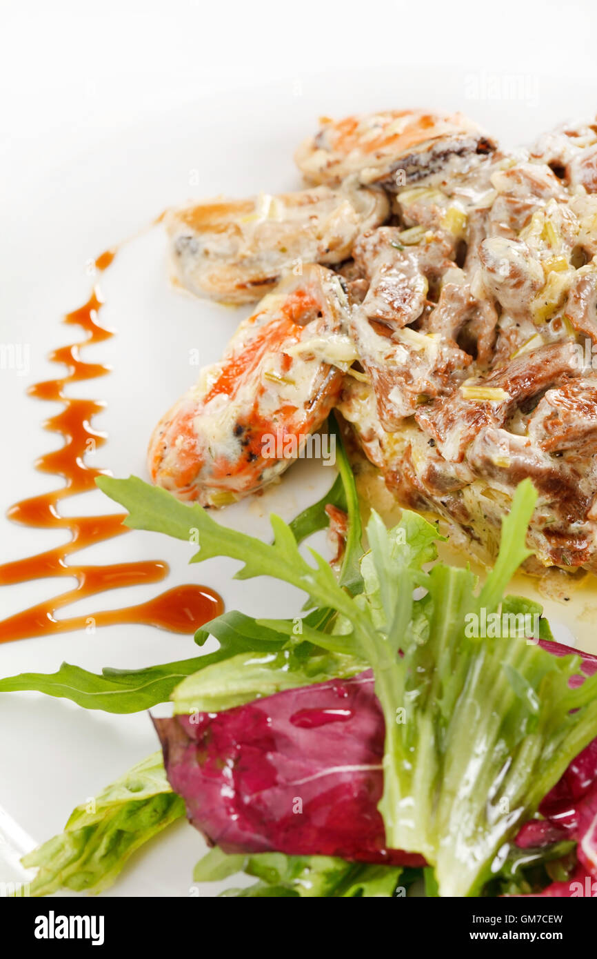 Fricassee with seafood and salad Stock Photo - Alamy